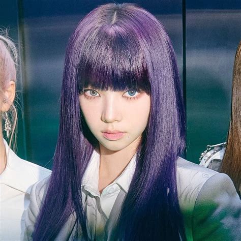 Two Women With Long Purple Hair Standing Next To Each Other