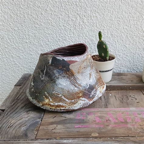 Slips Of Different Clays And Free Carving Vase