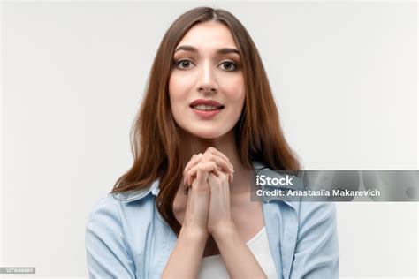 Charismatic Brunette Female Keeps Hands Together Near Chin Human Emotions Facial Expression