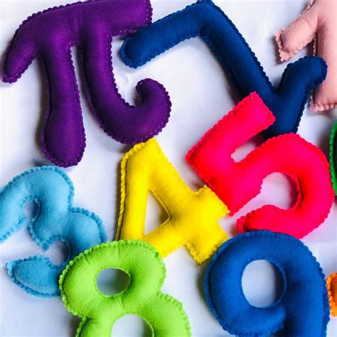 Colorful Felt Numbers Laid Out On Top Of Each Other