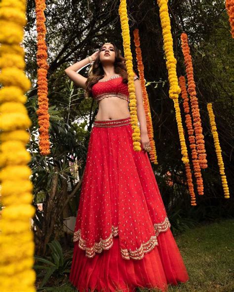 Nabha Natesh Looks Beautiful In A Red Bridal Lehenga