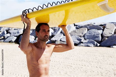 Portrait Of Handsome Spanish Brunette Hair Man With Nude Torso Carrying