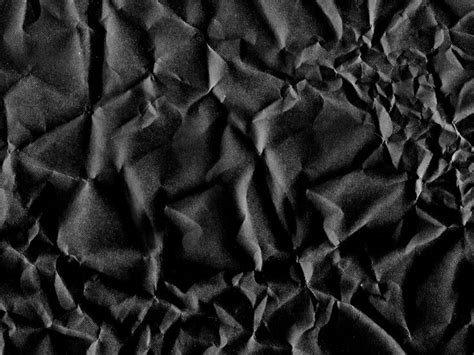 Black And White Photograph Of Wrinkled Paper With No Background Or