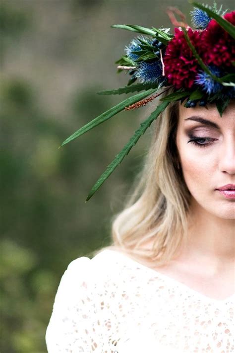 A Woman With A Flower Crown On Her Head Wearing A White Dress And Red