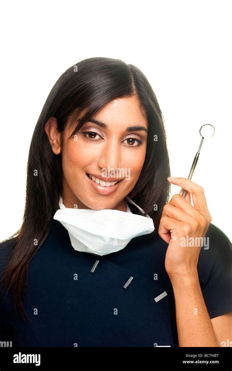 Female Dentist Holding Dental Equipment And Smiling Stock Photo Alamy