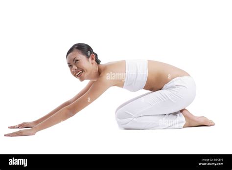 Woman Kneeling On Floor Stretching Stock Photo Alamy