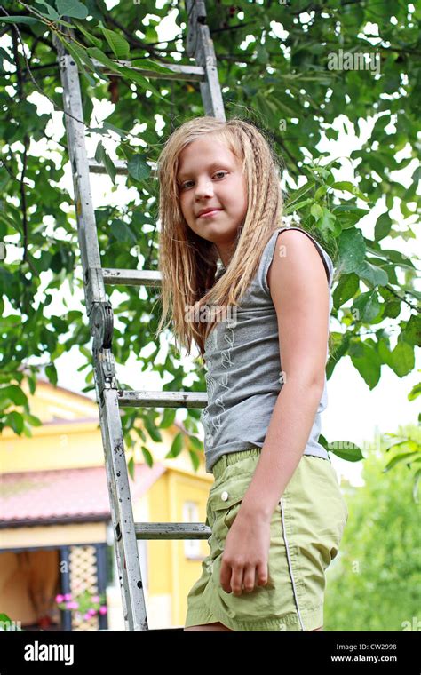 A 12 Years Old Girl In The Garden Stock Photo Alamy