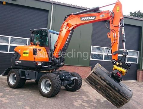 Materieel Mobiele Graafmachine Doosan DX57W 5 49586500 A Van Dongen