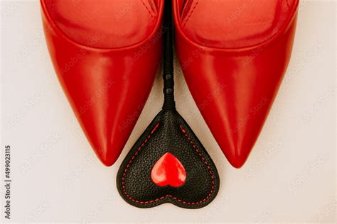 Red Leather High Heel Shoes And Bdsm Crop Strict Womans Domination Adult Role Play And Bdsm