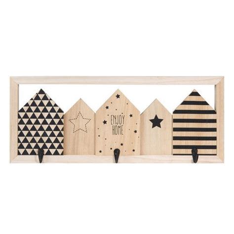 Three Wooden Houses With Black And White Designs On Them One Is
