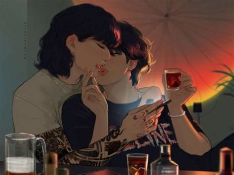 Two People Sitting At A Table With Drinks In Front Of Them