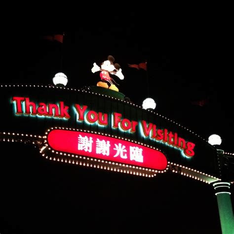 A Lighted Sign That Says Thank You For Visiting With Mickey Mouse On