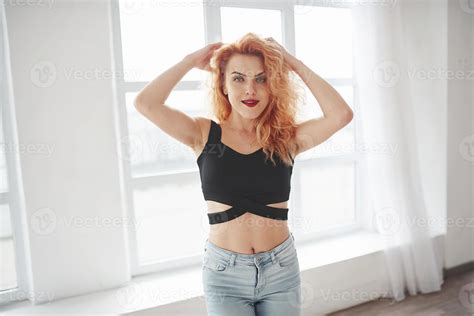 Sexy Woman Attractive Redhead Girl Posing In The Spacey Room Near The Window 8681320 Stock