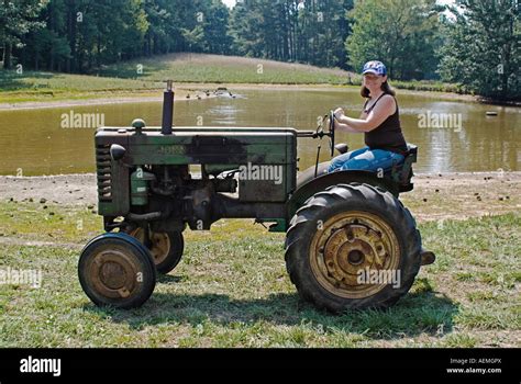 Woman On John Deere Model M Tractor Stock Photo Alamy