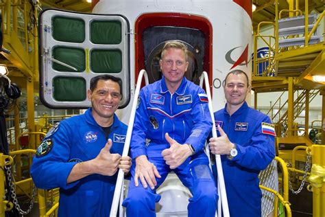 Soyuz Rocket Rolls Out For Launch Of Russian American Crew To Space