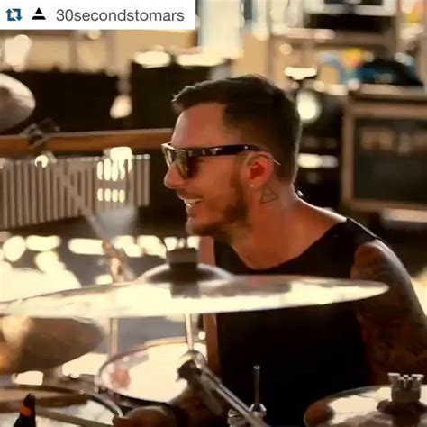 A Man With Sunglasses On Playing The Drums