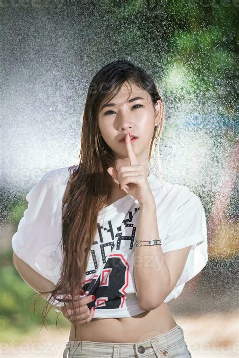 Happy Chinese Girl Is Getting Wet And Rain Stock Photo At Vecteezy