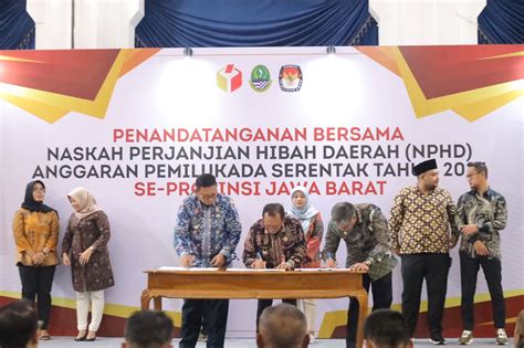 NPHD PENDANAAN PEMILUKADA 2024 DITANDATANGANI MAJALAH INDONESIA