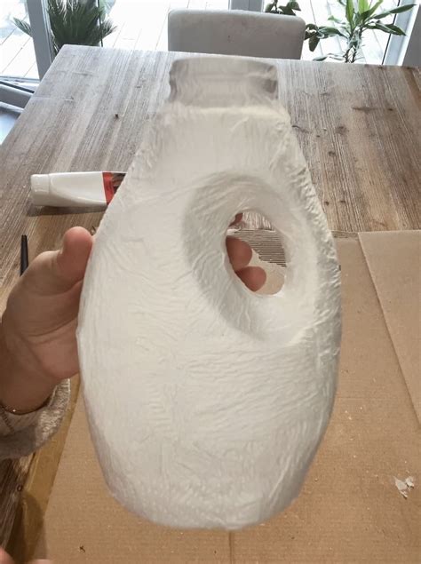 A Person Is Making A Sculpture Out Of Clay