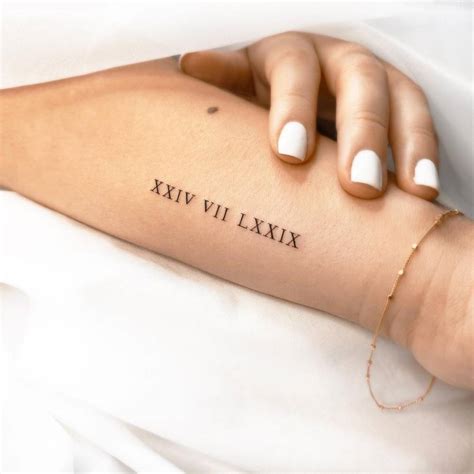 Roman Numerals Tattoo On The Forearm
