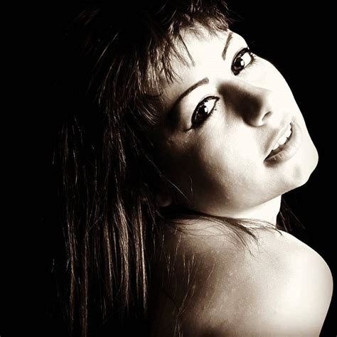 A Black And White Photo Of A Woman S Face