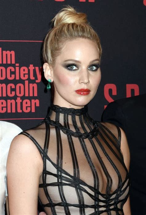 A Woman With Blonde Hair Wearing A Black Dress