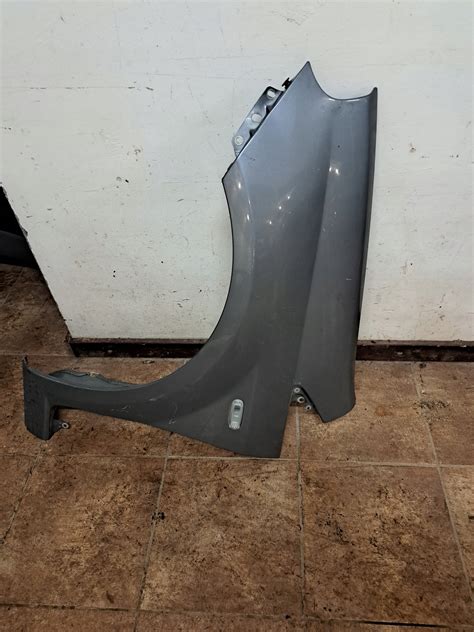 FIAT GRANDE PUNTO BŁOTNIK PRZEDNI LEWY za 222 zł z Bielsko Biała