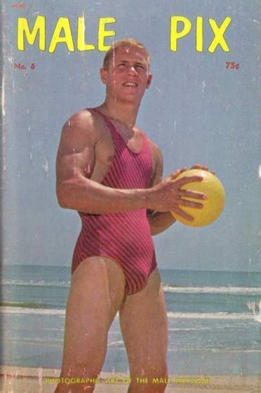 A Man In A Swimsuit Holding A Yellow Frisbee On The Cover Of Male Pix