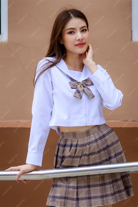 Premium Photo Cute And Young Girl Wearing Japanese Korean Style Schoolgirl Uniform And Pose