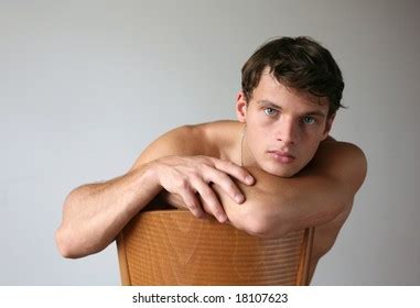 Sexy Muscular Man Sitting On Wooden Stock Photo 18107623 Shutterstock