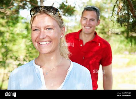 Woman And Man Walking In The Woods Stock Photo Alamy