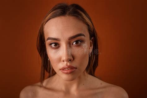 Pretty Asian Girl With Evening Makeup Naked Shoulders Earrings Looks