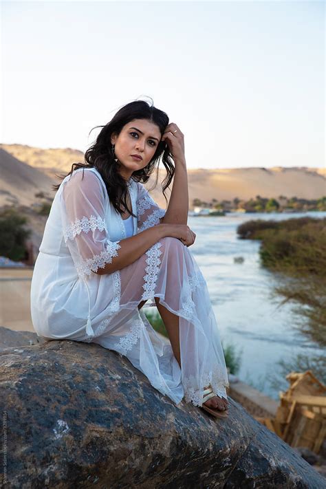Beautiful Egyptian Woman Sitting By The Nile By Stocksy Contributor