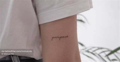 Word Purpose Tattooed On The Tricep