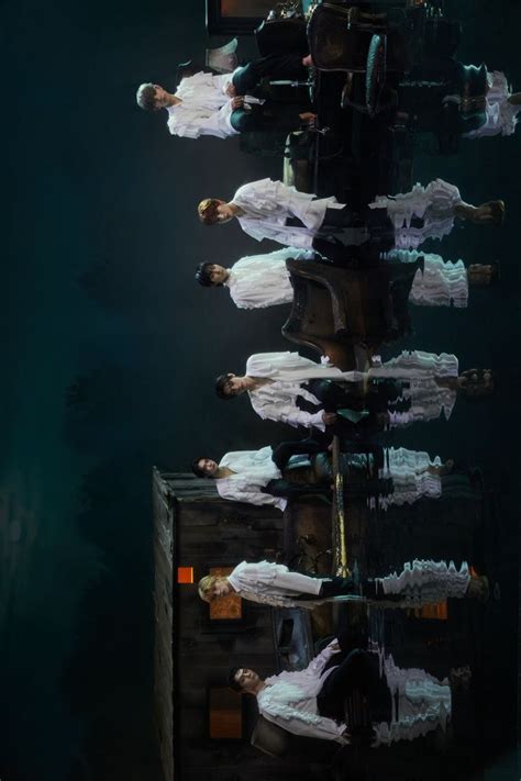 A Group Of People Standing Around Each Other