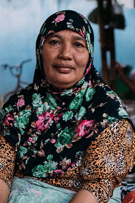 Indonesian Old Woman Selling Fruits And Vegetables In Local Market By