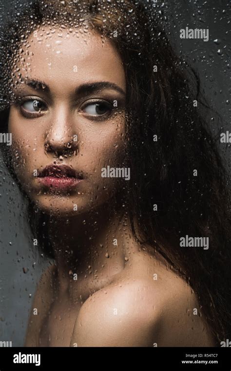 Attractive Brunette Woman Behind Wet Glass In Shower Stock Photo Alamy