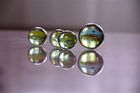Premium Photo Close Up Of Marbles On Table
