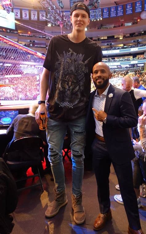 5 3 Demetrious Mighty Mouse Johnson Standing Next To 7 3 Kristaps