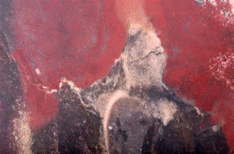 Textura Rojo Oscuro Y Negra De La Piedra Del Jaspe Foto De Archivo