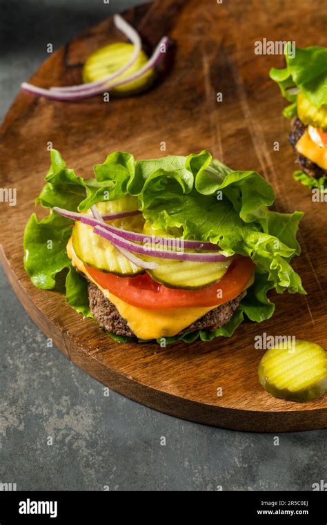 Gluten Free Paleo Bunless Cheeseburger With Lettuce And Tomato Stock