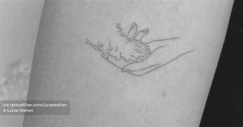 Fine Line Hand And Paw Tattoo Located On The Inner
