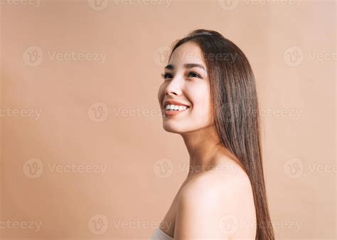 Beauty Nude Portrait Of Happy Young Beautiful Asian Woman With Healthy Dark Long Hair In Top