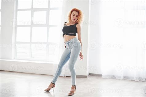 Full Height Photo Attractive Redhead Woman Posing In The Spacey Room Near The Window 8681291