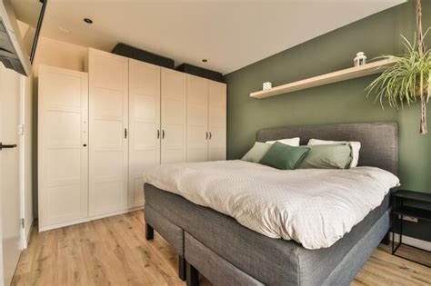 Premium Photo A Bedroom With A Large Bed And White Closets