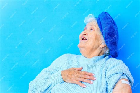 Premium Photo Mature Woman 80 Years Old Showing Her Arm With Bandage After Receiving