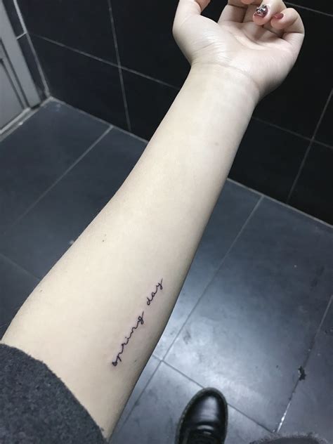 A Woman S Arm With The Word Love Written On It And Her Name In Cursive