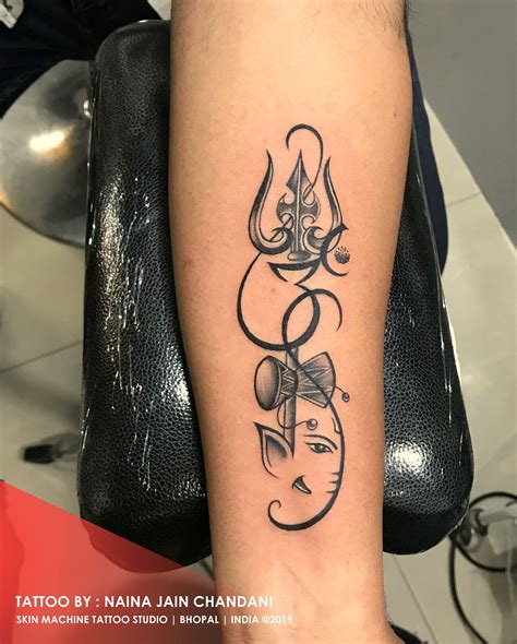 Om Trishul Ganesh Tattoo Om Tattoo Design Tattoo Designs Wrist