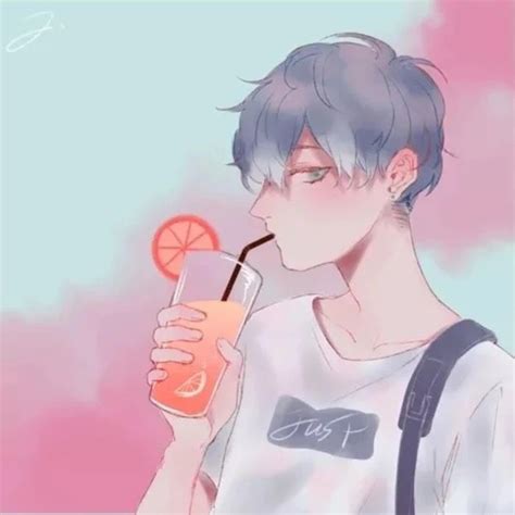 A Man Holding A Drink In His Right Hand