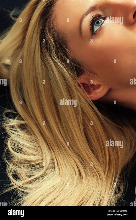 Blond Woman Laying Down Looking Up Stock Photo Alamy